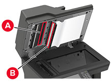Vertical dark streaks on output when scanning from the ADF | Lexmark MX722